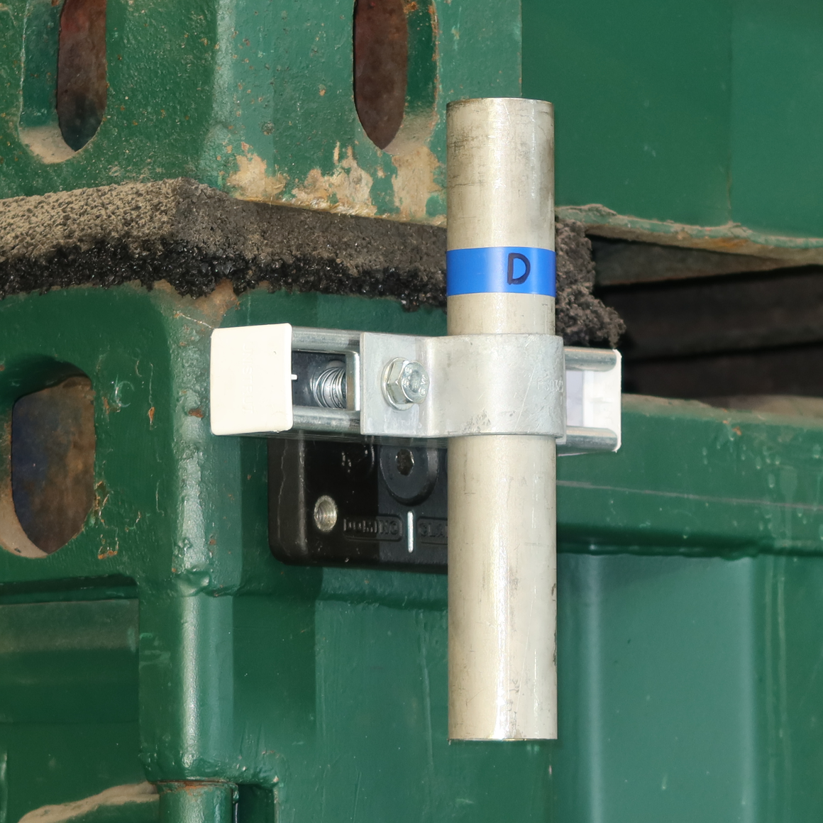 Attach almost anything to shipping containers. | Domino Clamps